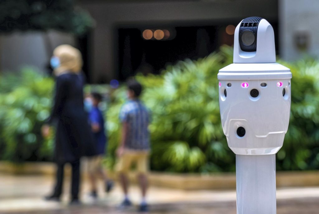 Face mask detection robot with a voice warning of a fine for not ...